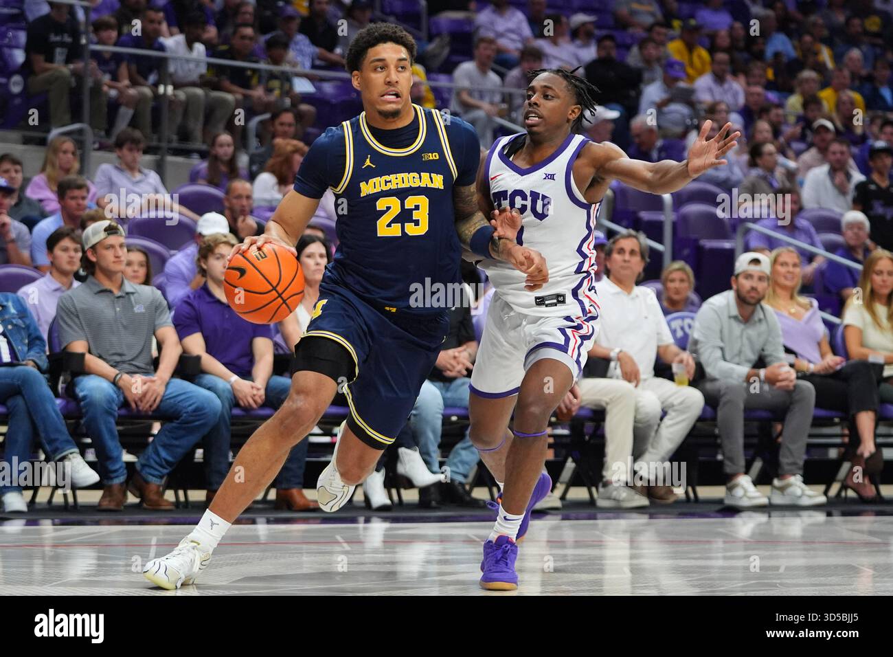 Michigan forward Yaxel Lendeborg (23) drives against TCU guard Jayden ...