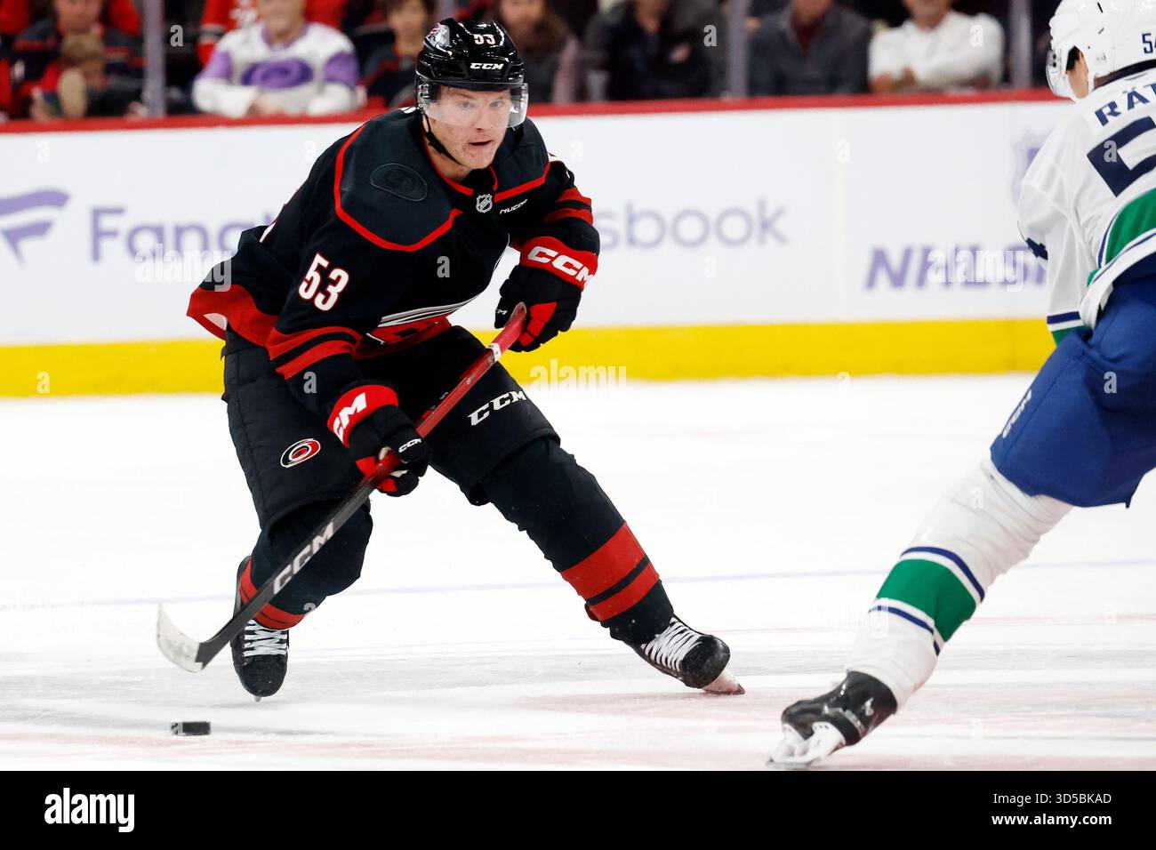 Carolina Hurricanes' Jackson Blake (53) carries the puck against the ...