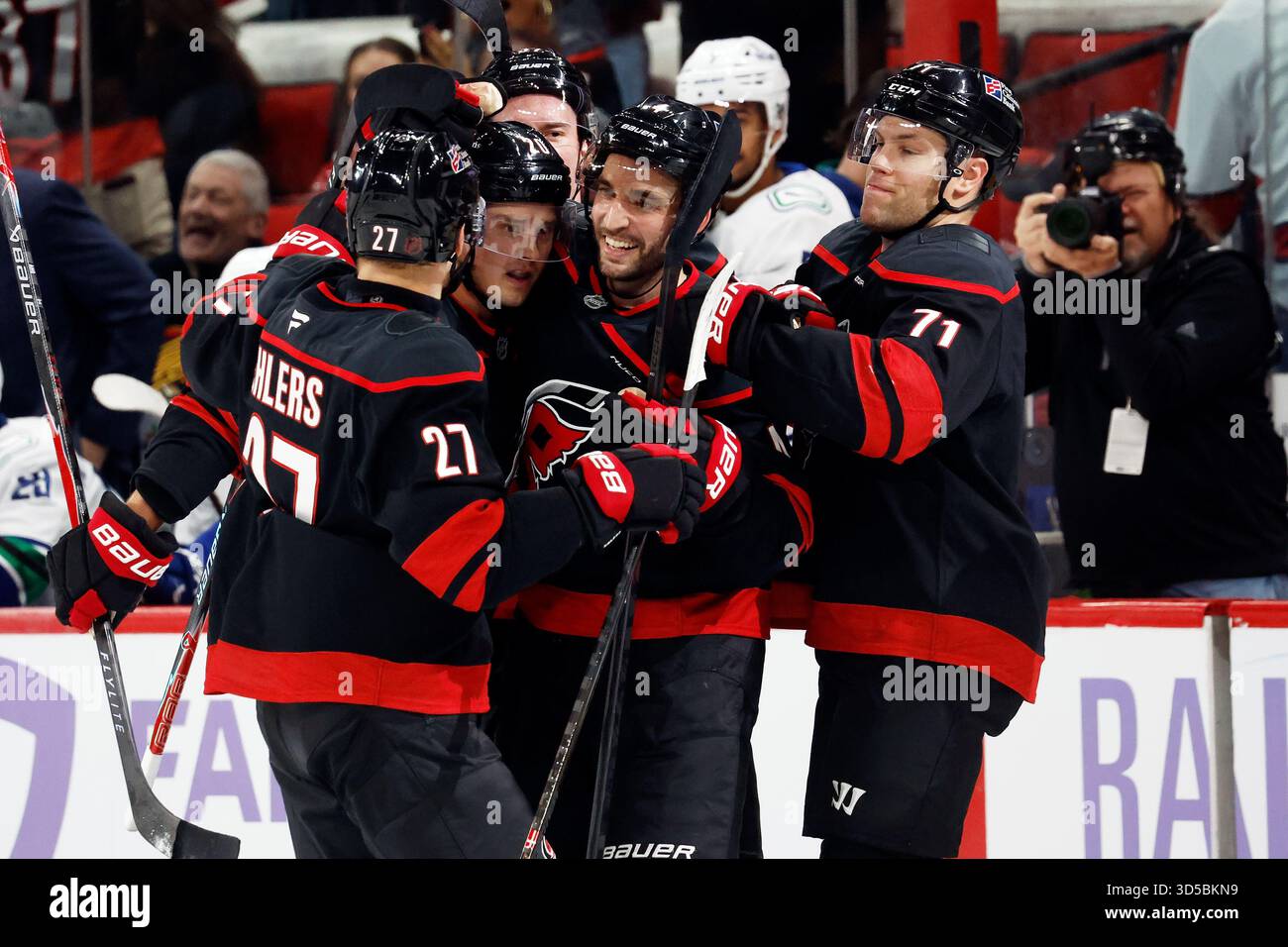 Carolina Hurricanes' Sebastian Aho (20), second left, celebrates his ...