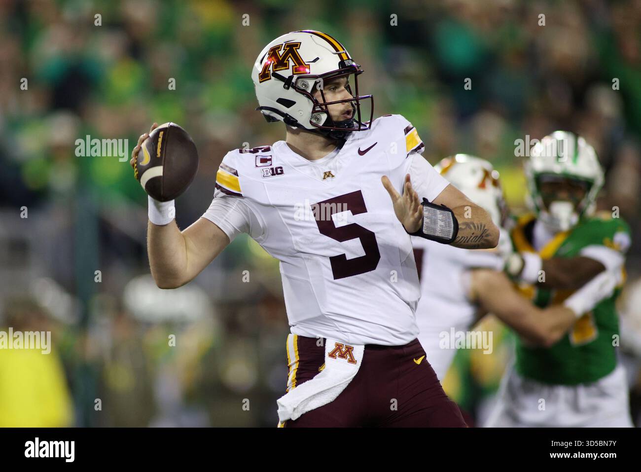 Minnesota quarterback Drake Lindsey (5) looks to trow a pass during the ...