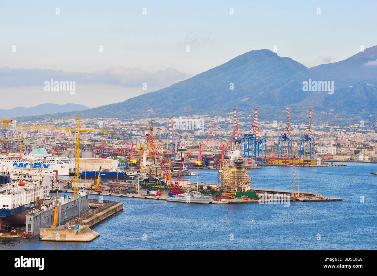 Naples, Italy - September 21, 2025: Seaport with cargo ships, cranes ...