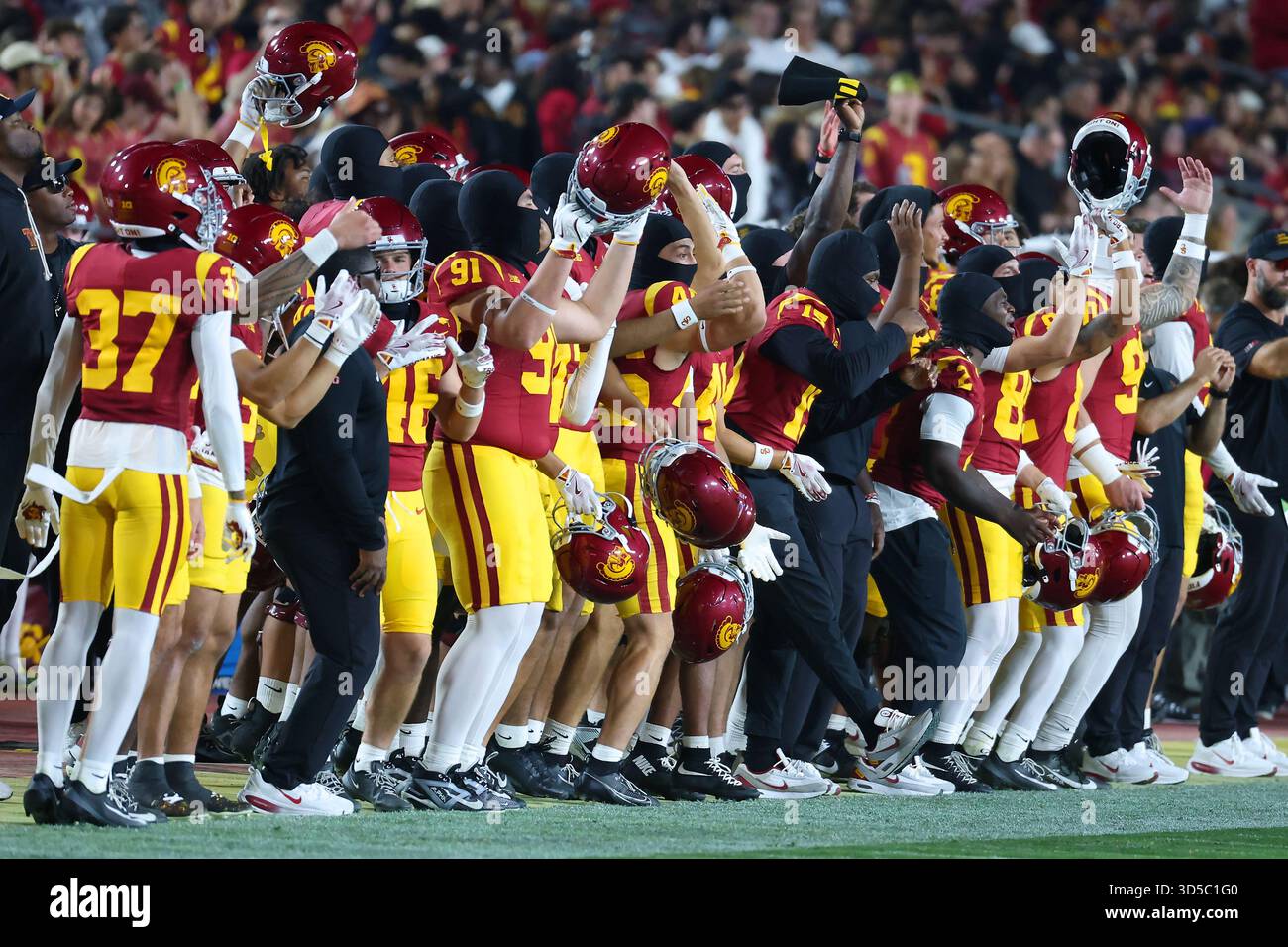 Southern California players cheer on the sideline during an NCAA ...