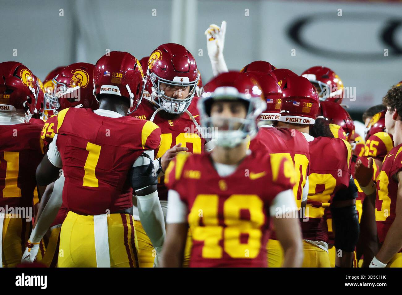 Southern California players huddle before an NCAA college football game ...