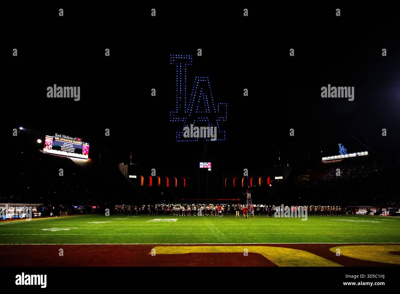 A group of drones display the "LA" logo in lights over the Los Angeles ...