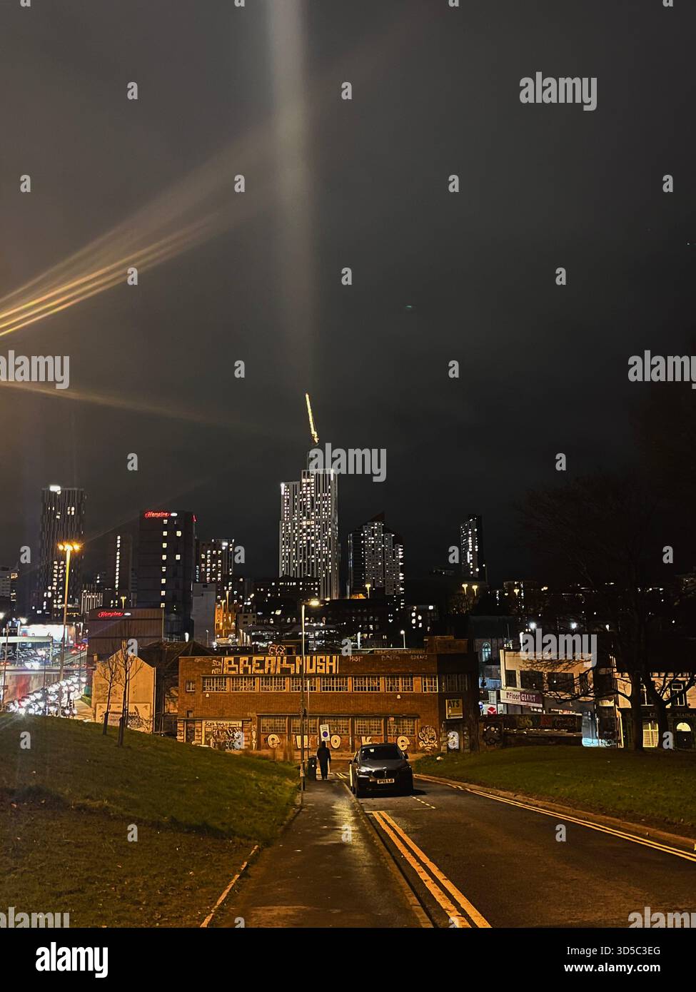 Dramatic night view of Leeds skyline with modern skyscrapers and light ...