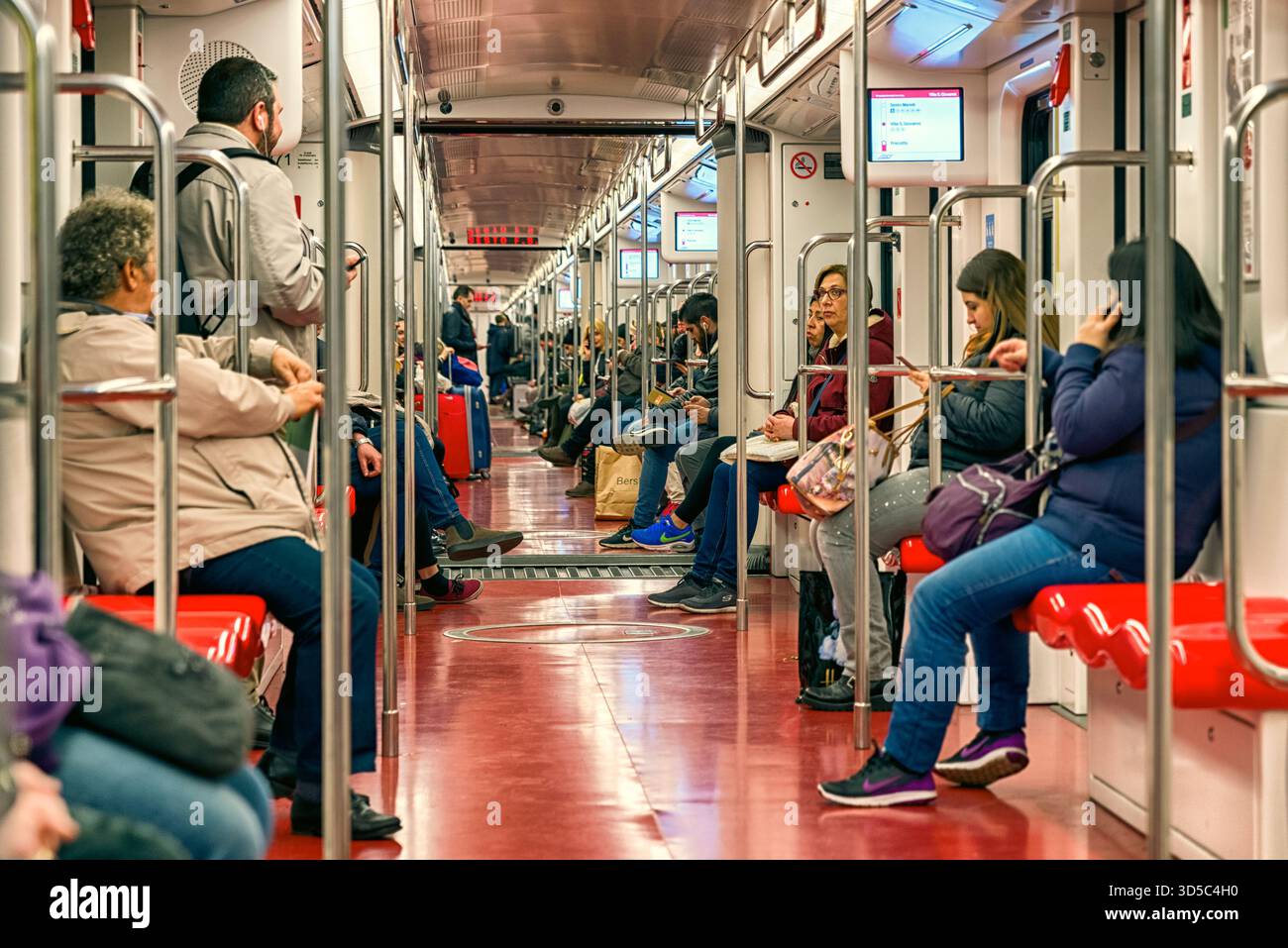 Milan, Italy - April 13, 2018: Passengers travelling inside a Milan ...