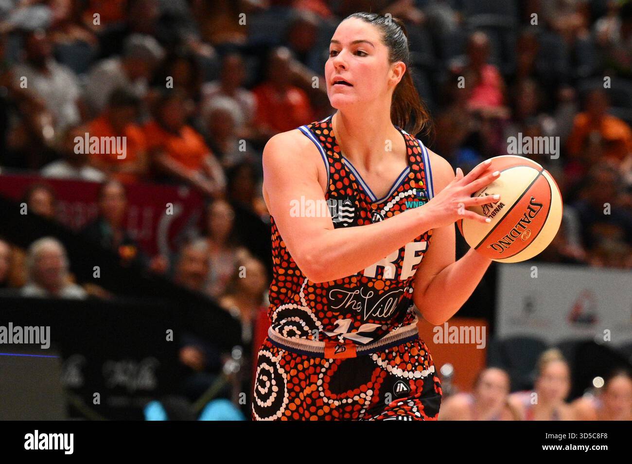 Alex Fowler of the Townsville Fire passes the ball during the WNBL ...