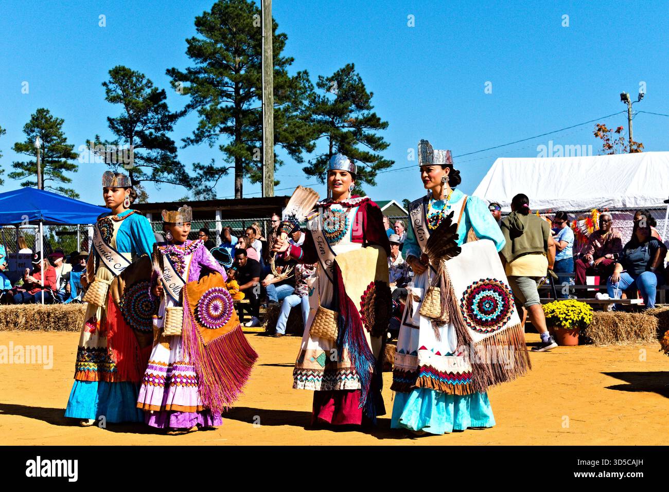Bolton, NC – October 18, 2025: Four women in traditional colorful dress ...