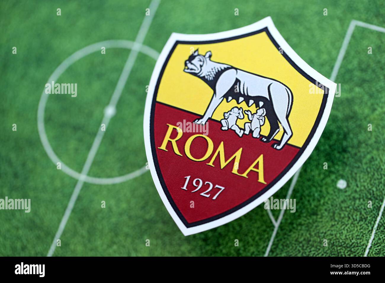 KYIV, UKRAINE - FEBRUARY 23, 2025 AS Roma football club badge lies on ...