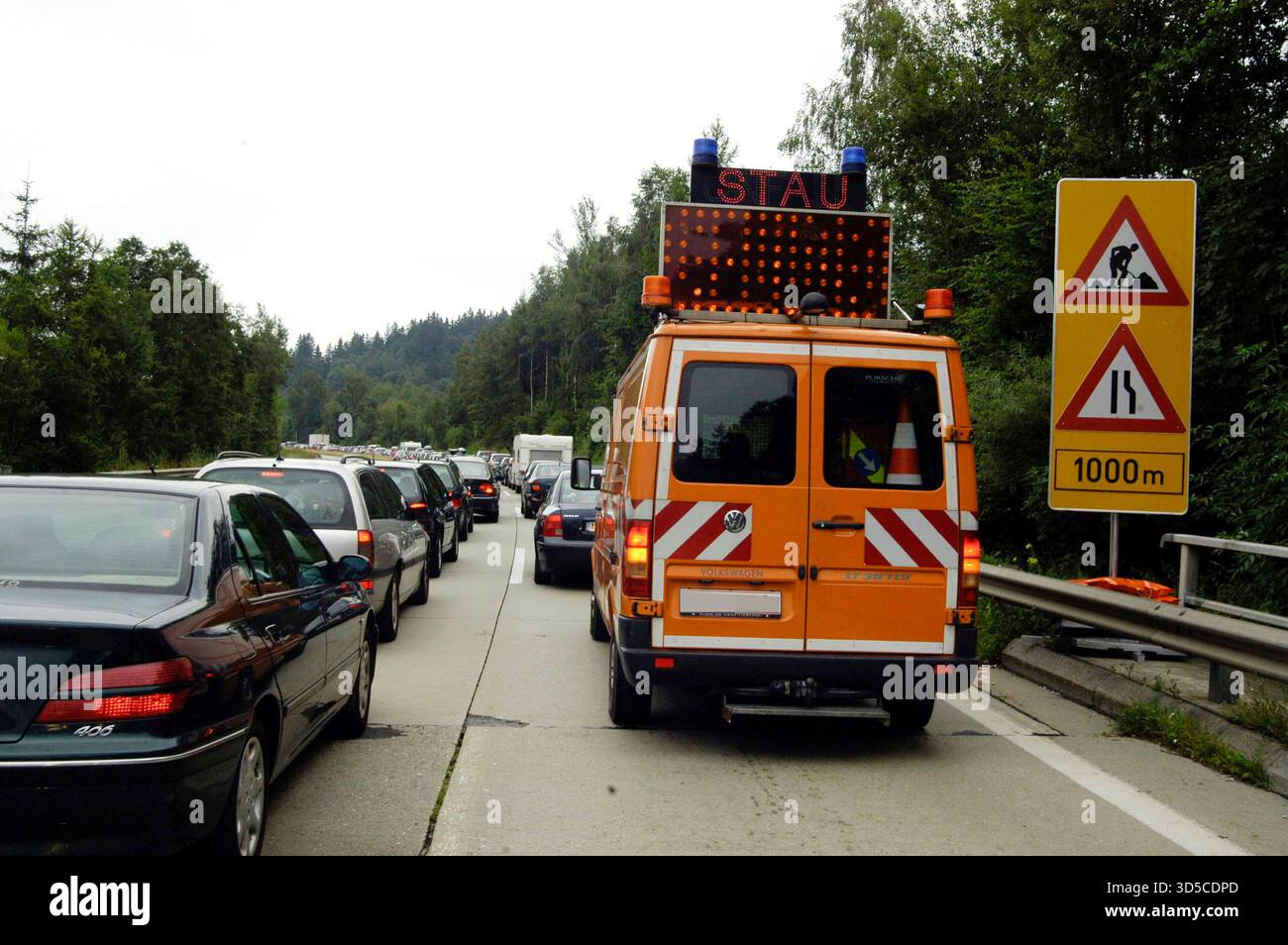a traffic congestion warning road sign standing on the street traffic ...