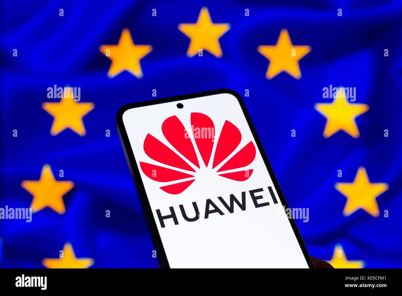 The Huawei Corporation logo is being displayed on a mobile phone with ...