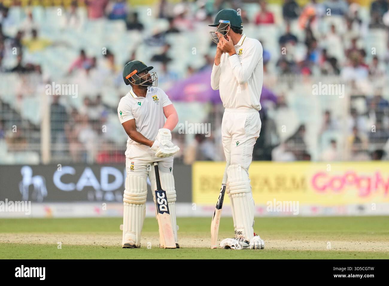 South Africa's captain Temba Bavuma, left, speaks to batting partner ...