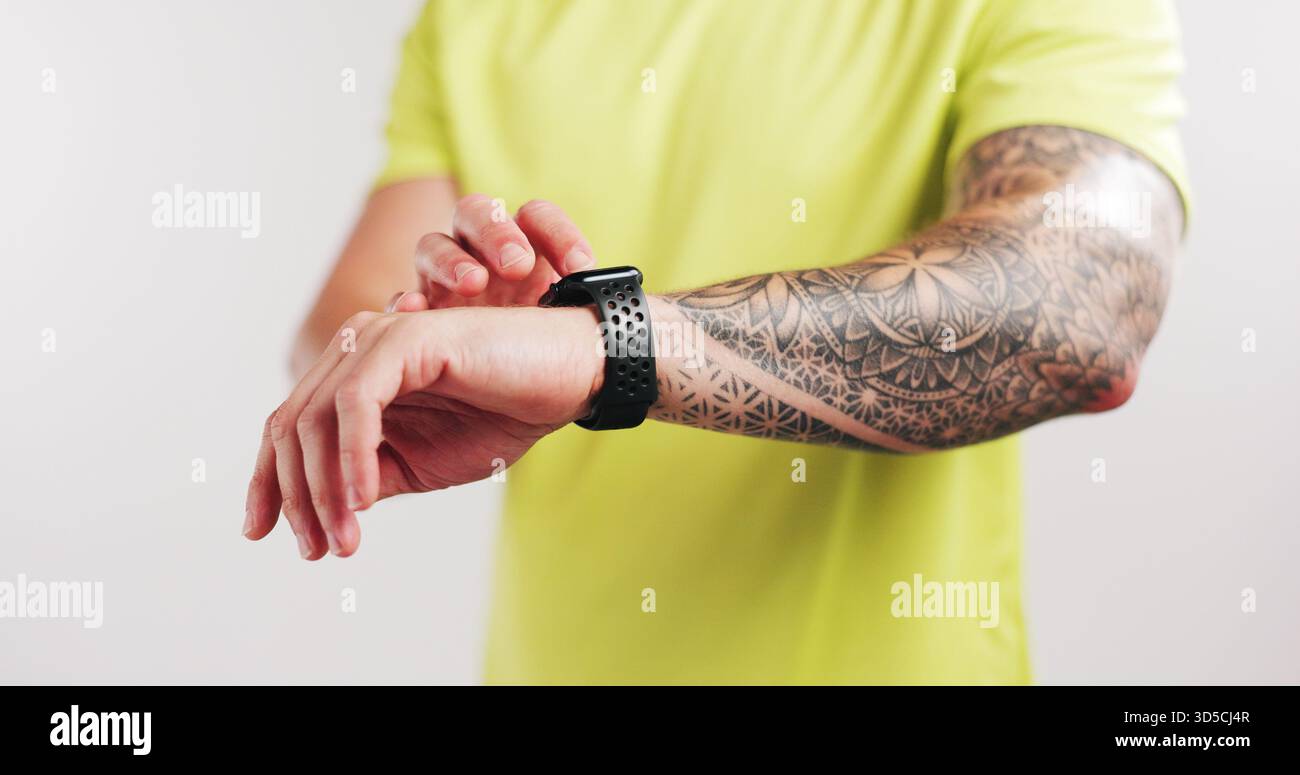 Smart watch, fitness and hands of man in studio for heart rate sensor ...