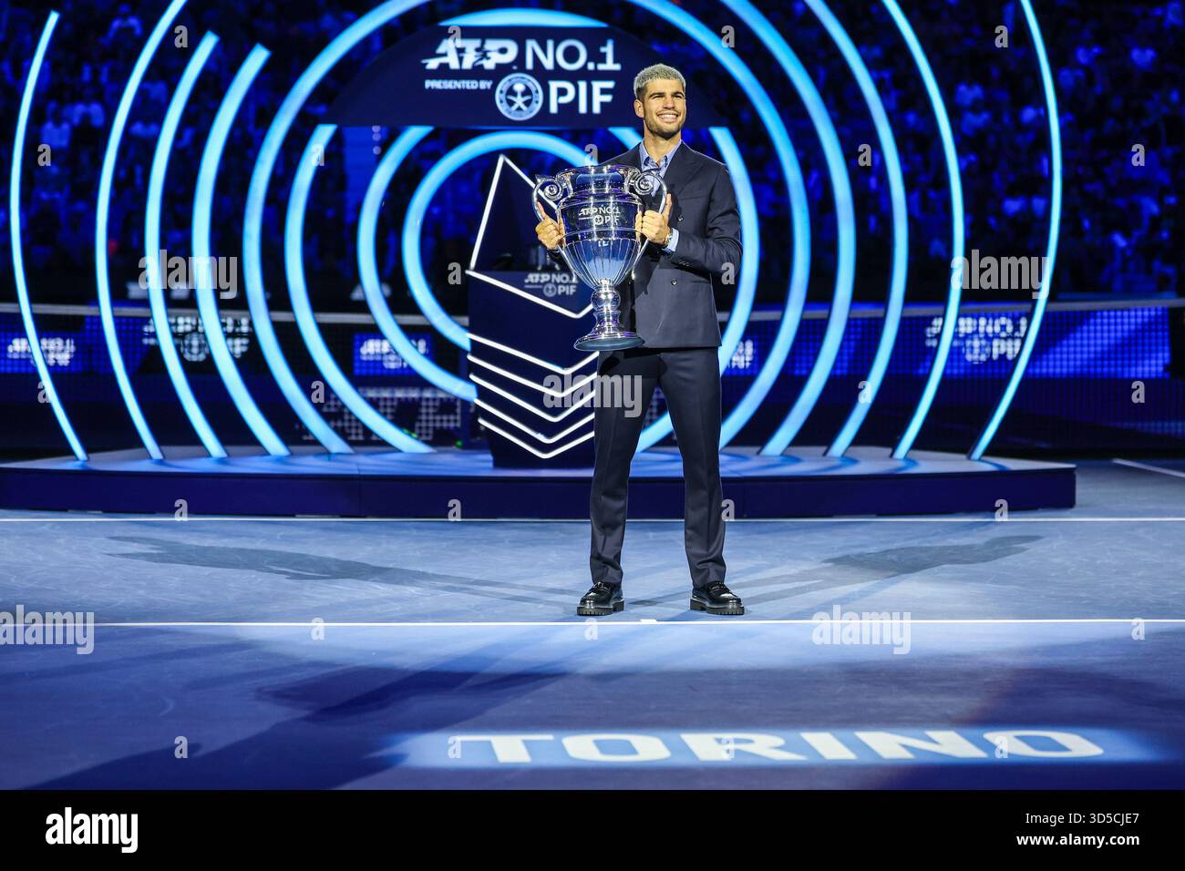 Carlos Alcaraz of Spain holds the 2025 Year-End ATP World No.1 Trophy ...