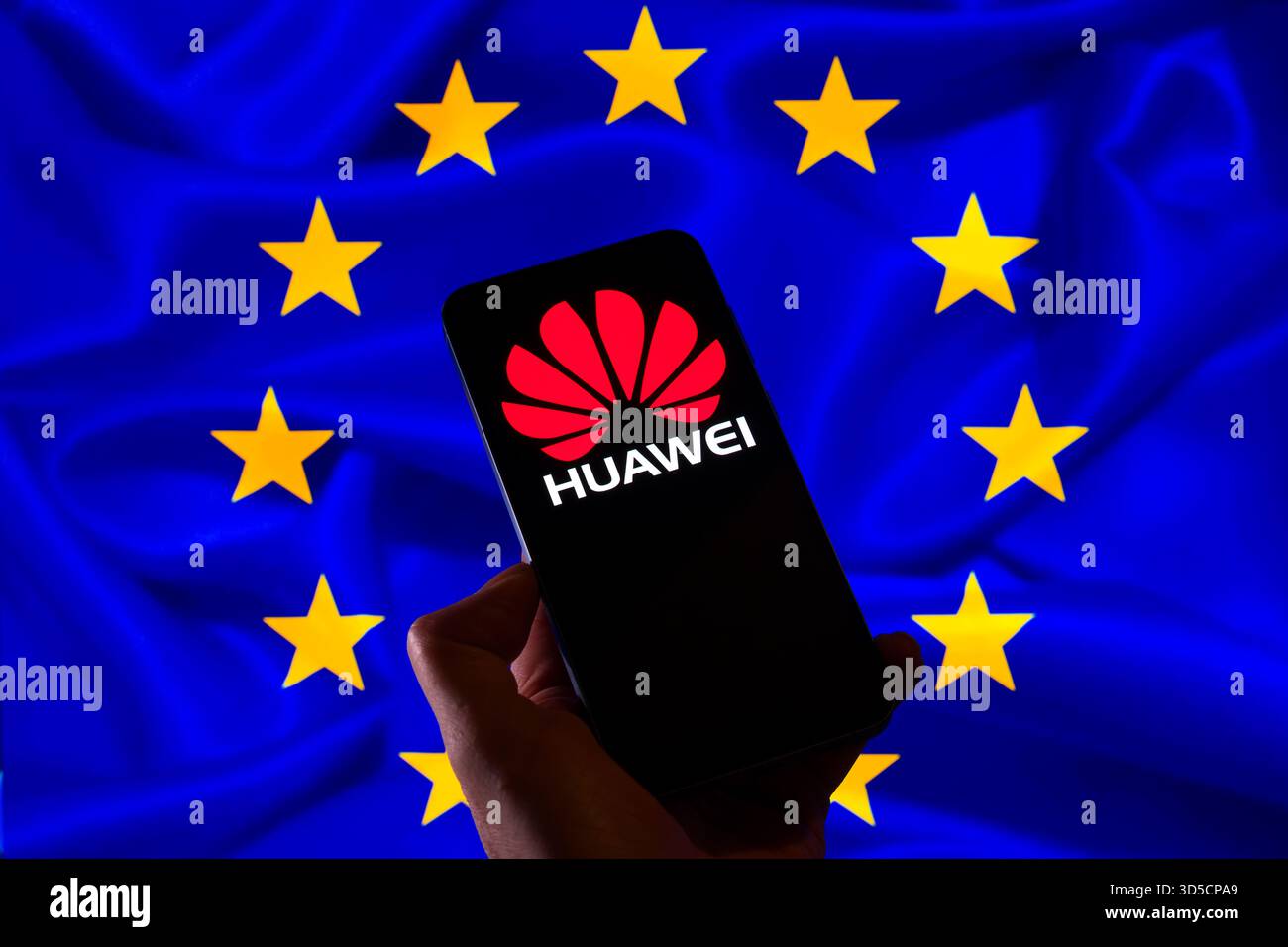 The Huawei Corporation logo is being displayed on a mobile phone with ...