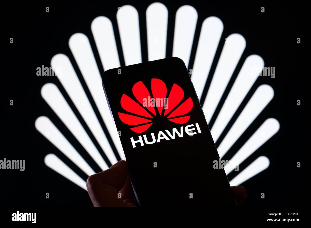 The Huawei Corporation logo is being displayed on a mobile phone with ...