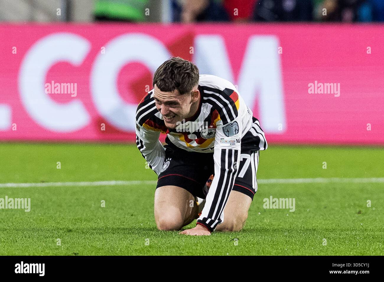 Florian Wirtz (Germany, 17) is holding his ankle after a duel FIFA ...