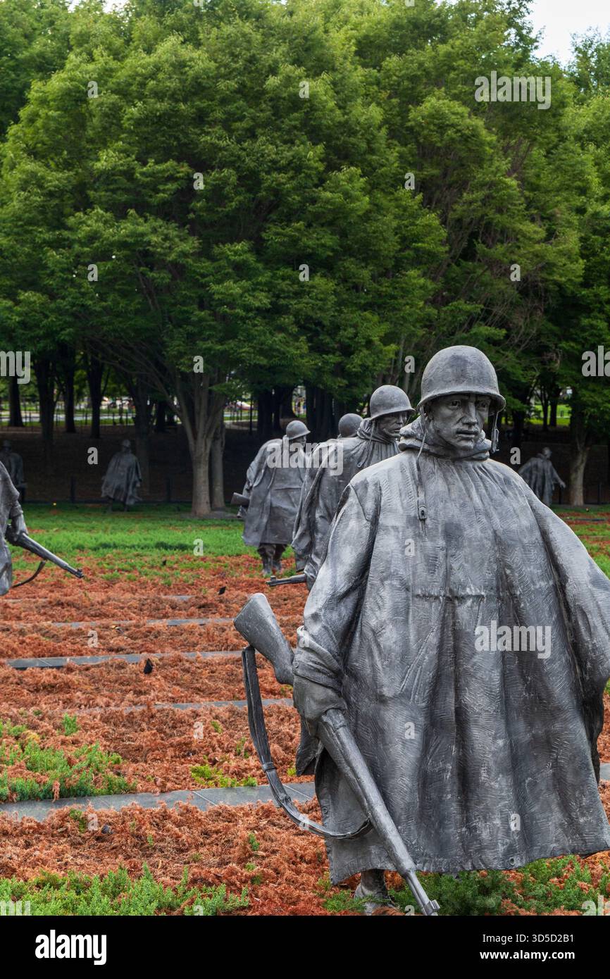 A group of statues of soldiers in uniform stand in Korean War Veterans ...