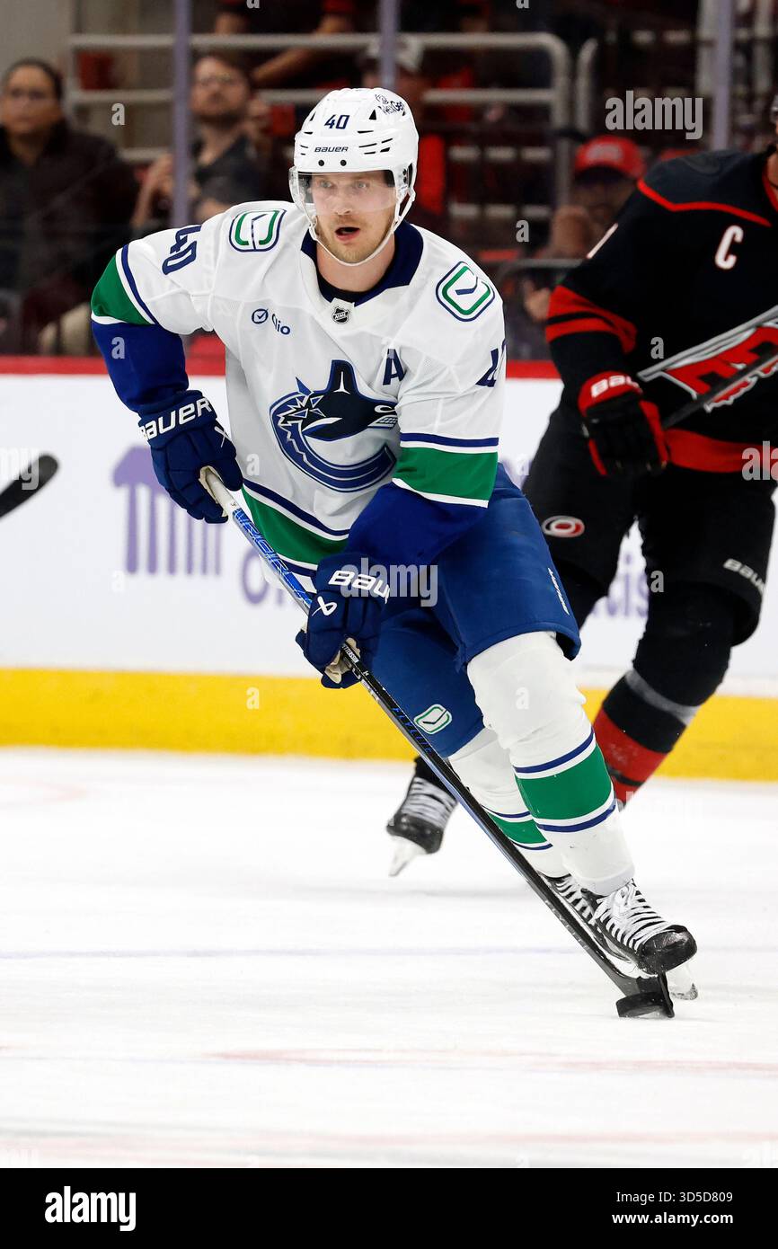 Vancouver Canucks' Elias Pettersson (40) moves the puck against the ...