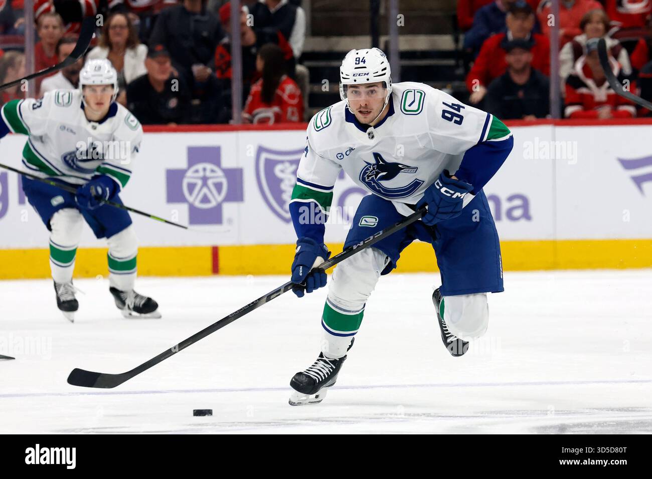 Vancouver Canucks' Linus Karlsson (94) moves the puck against the ...
