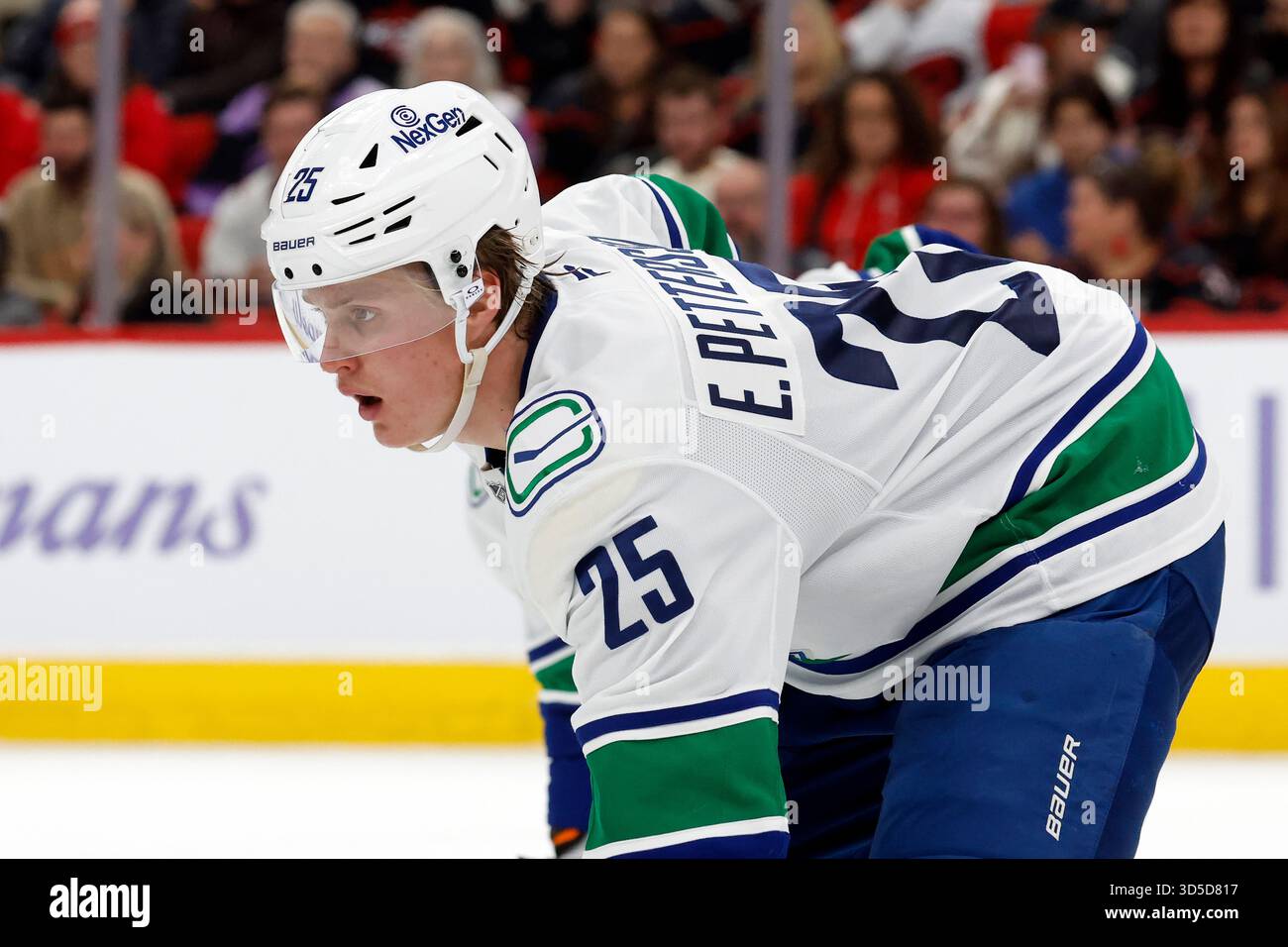 Vancouver Canucks' Elias Pettersson (25) waits for a face-off against ...