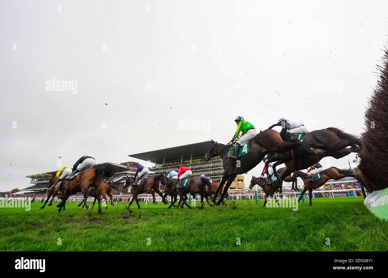 Runners and riders clear a fence during the Debenhams Amateur Jockeys ...
