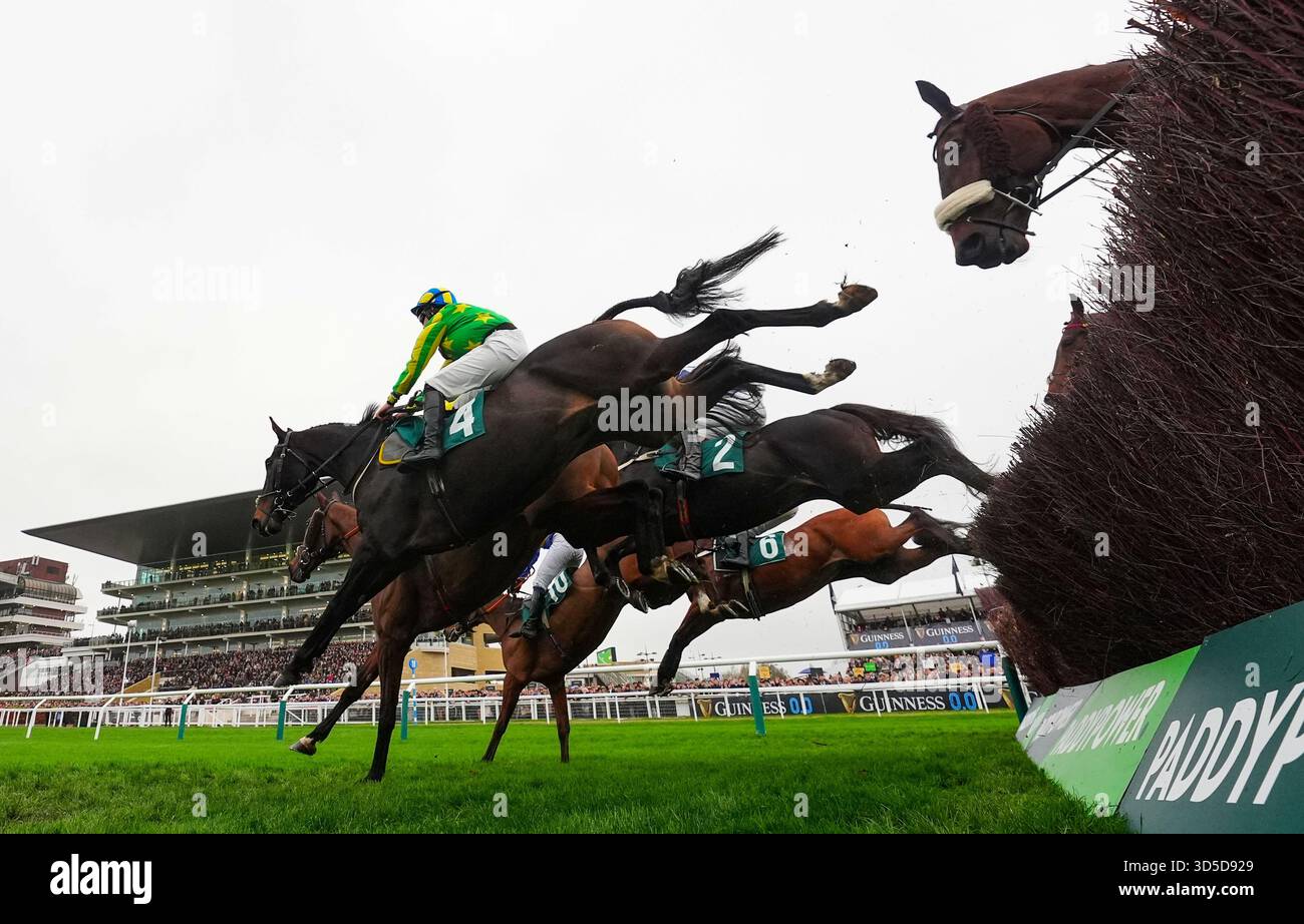 Runners and riders clear a fence during the Debenhams Amateur Jockeys ...