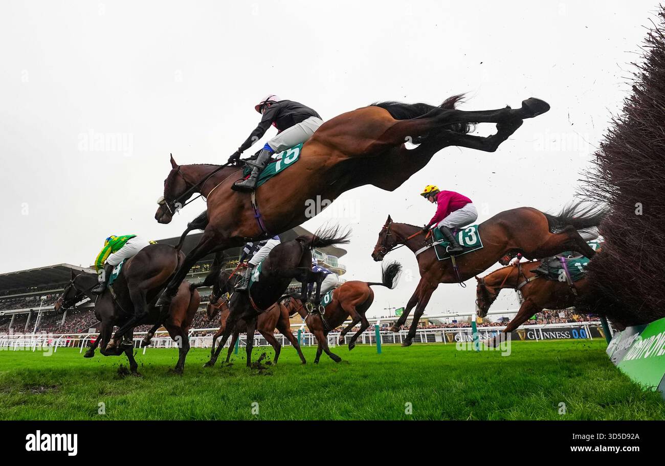 Runners and riders clear a fence during the Debenhams Amateur Jockeys ...