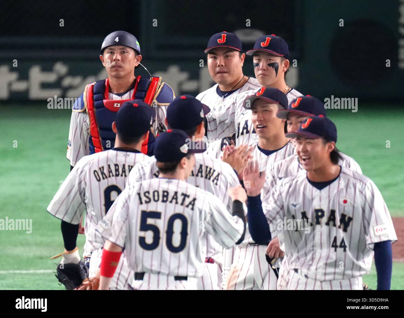Players of the Japan national baseball team celebrate after winning the ...