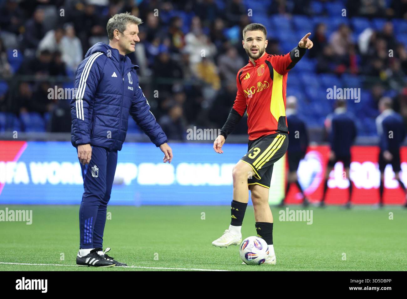 Belgium's assistant coach Stephane Jobard and Belgium's Nicolas Raskin ...