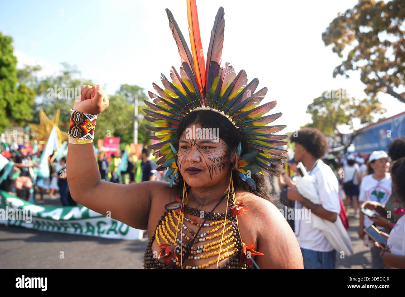 An Indigenous activist gestures during a climate protest during the ...