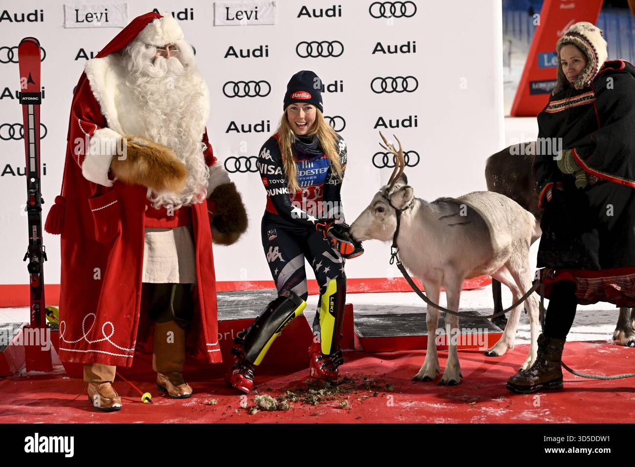Winner USA's Mikaela Shiffrin feeds the reindeer of Santa Claus after ...