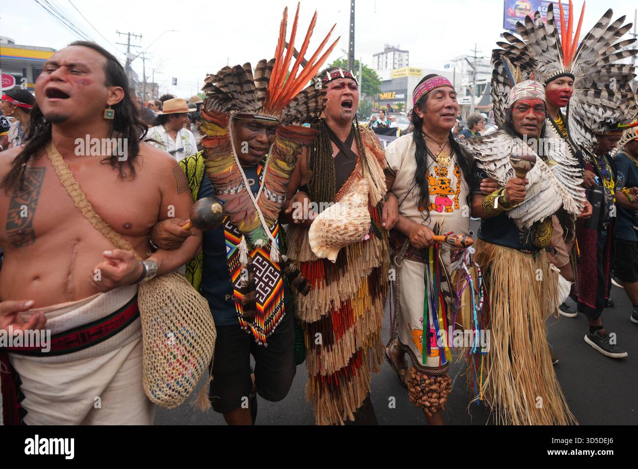 Indigenous activists participate in a climate protest during the COP30 ...