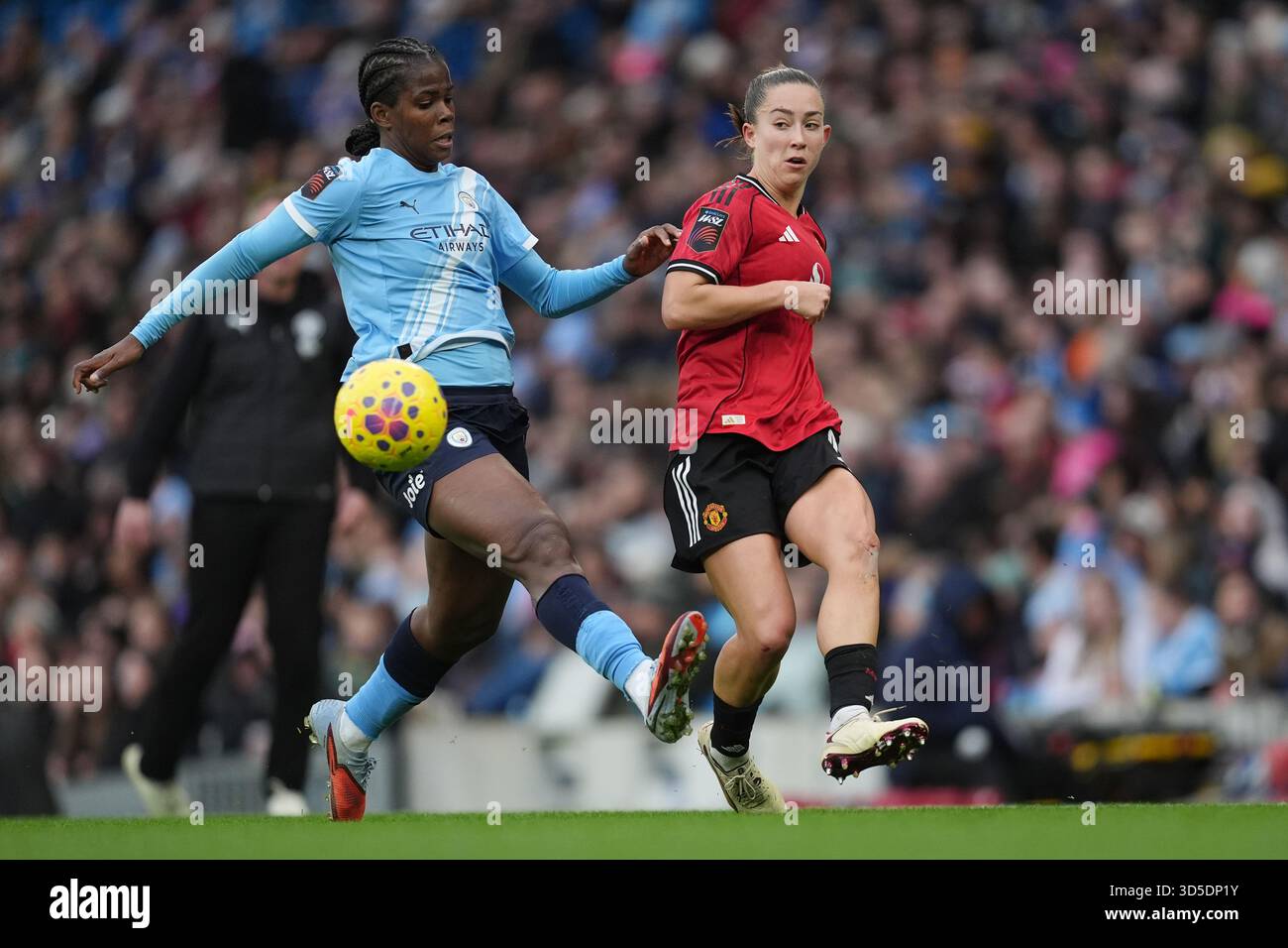 Manchester City's Khadija Shaw (left) and Manchester United's Maya Le ...