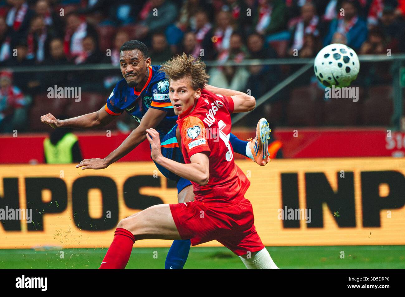Warsaw, Poland. 14th November, 2025. Ryan Gravenberch (left, Holland) taking a shot during match ...