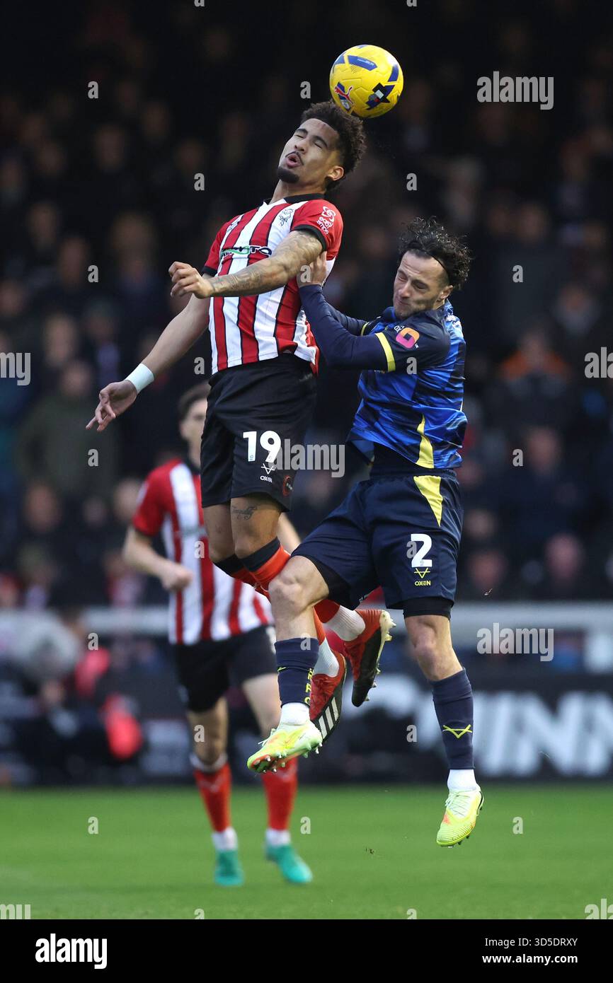 Lincoln City's Francis Okoronkwo (left) and Doncaster Rovers' Jamie ...