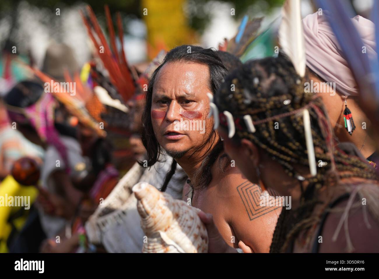 Jacob Johns, center, a member of the Akimel O'Otham and Hopi nations ...