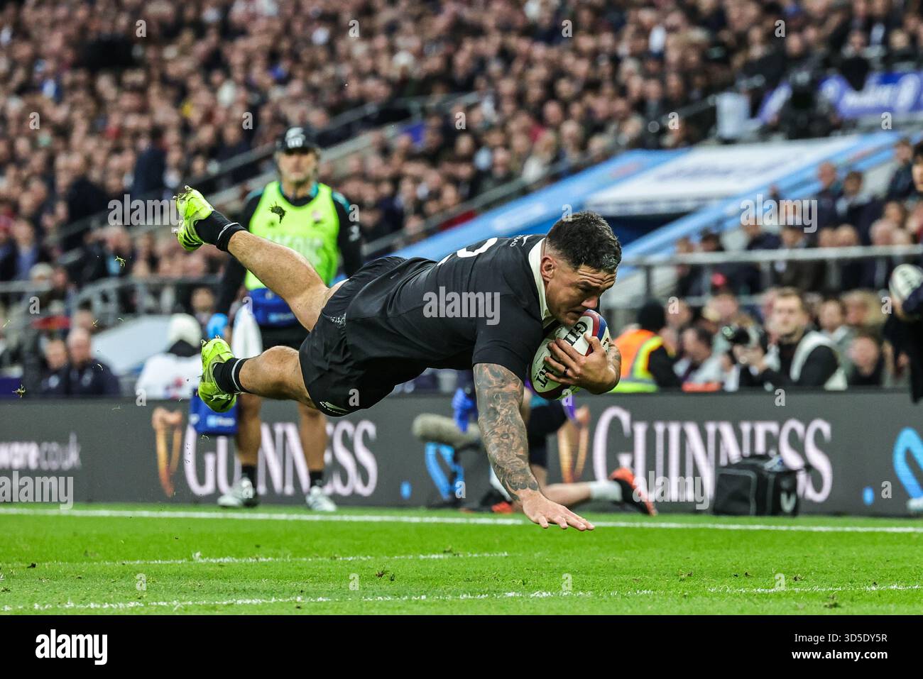 Codie Taylor of New Zealand goes over for a try during the Quilter ...