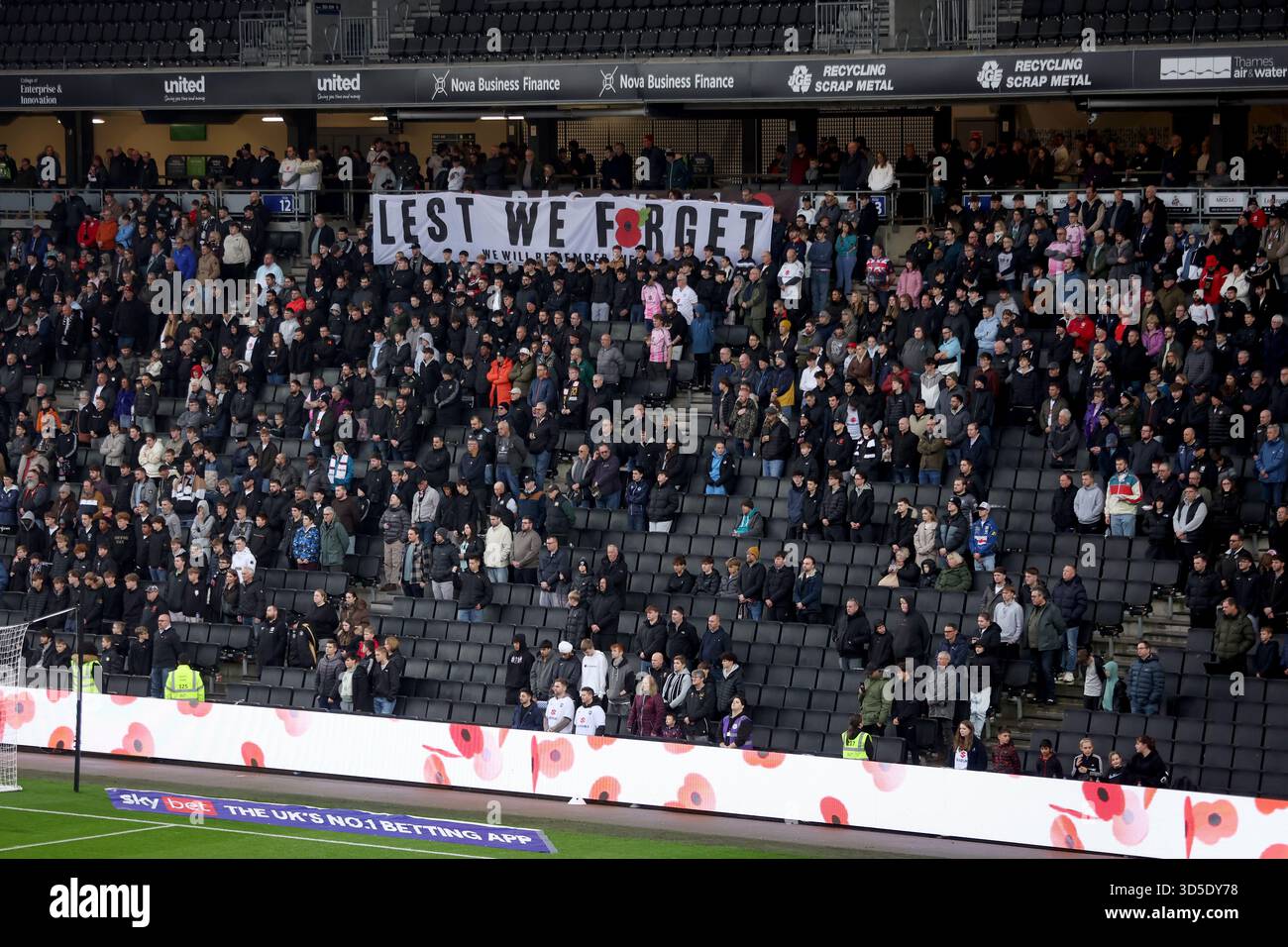 Milton Keynes Dons fans in the stands during a minutes silence in ...
