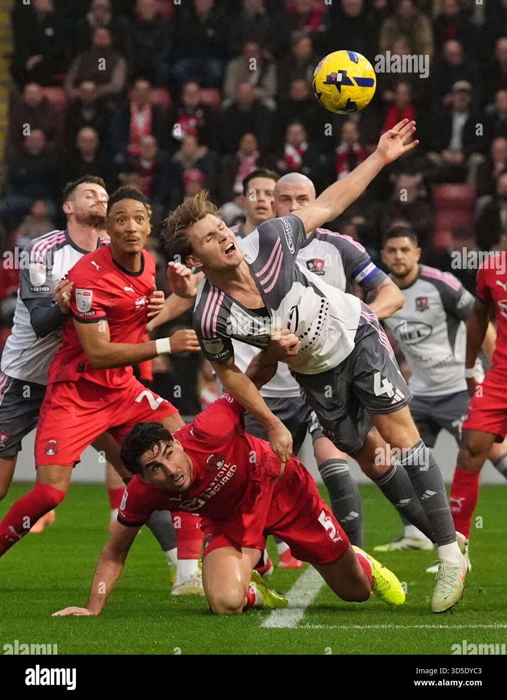 Leyton Orient's Dan Happe (lower left) grabs the shirt of Exeter City's ...