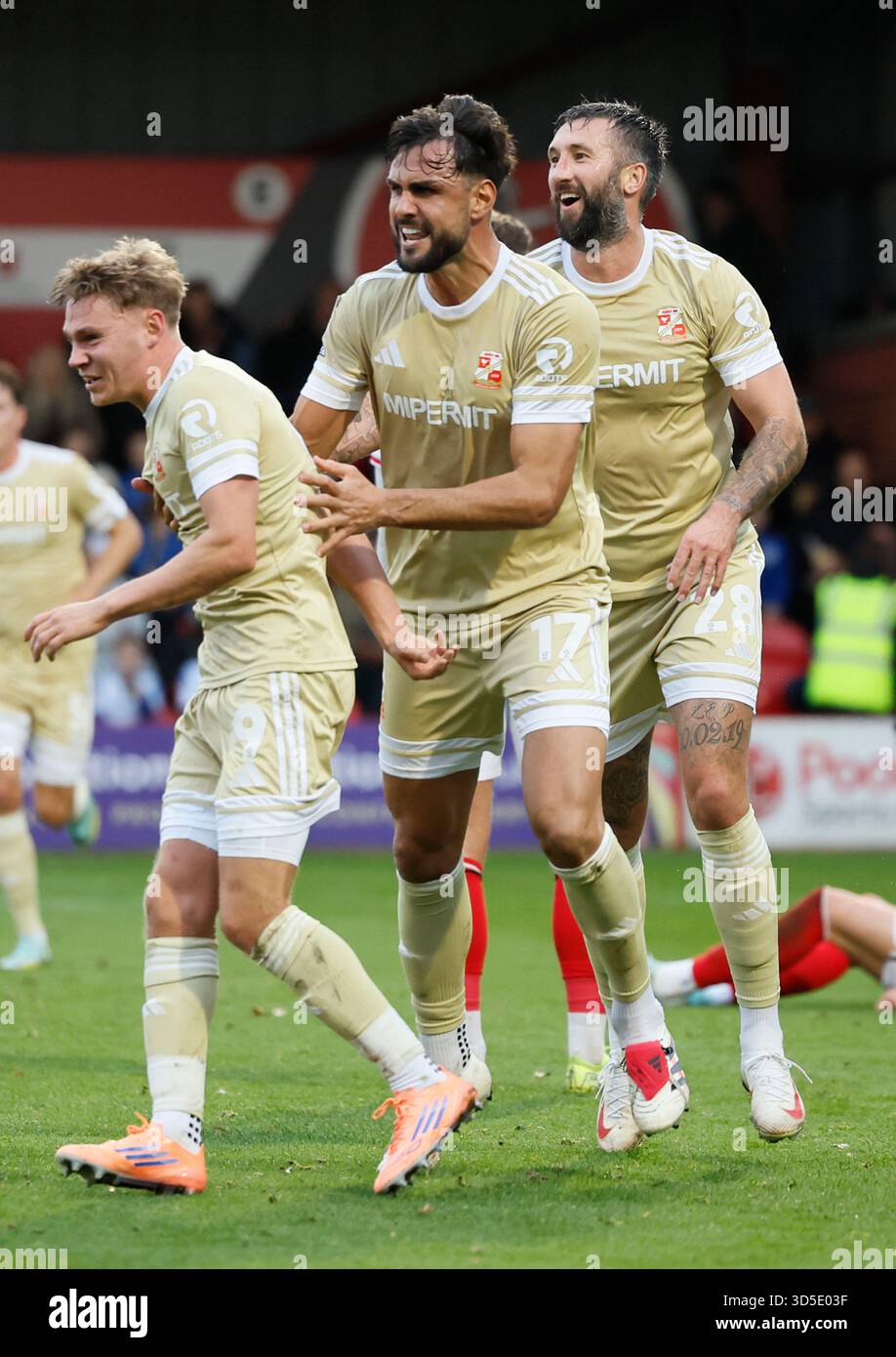 Swindon Town's Ryan Tafazolli (centre) celebrates scoring their side's ...