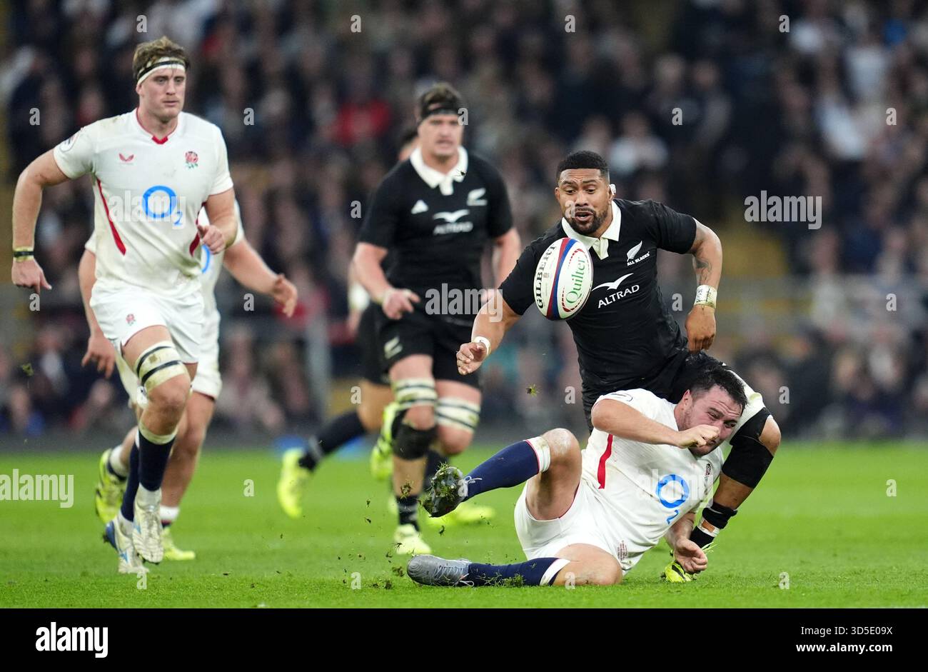 England's Jamie George collides with New Zealand's Ardie Savea during ...