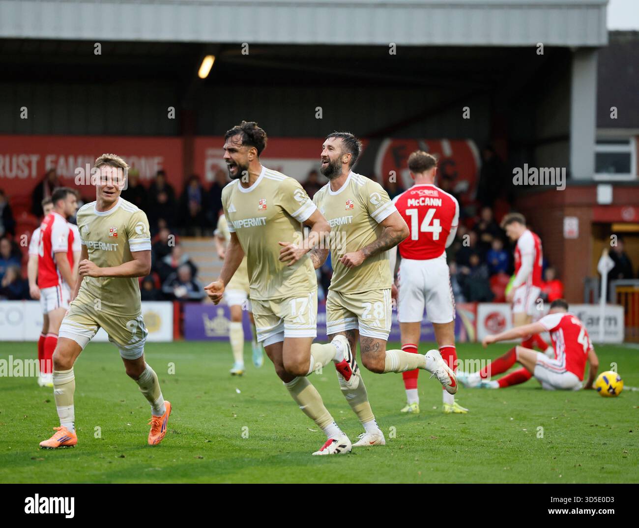 Swindon Town's Ryan Tafazolli (centre) celebrates scoring their side's ...