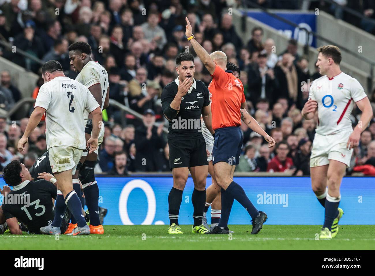 Quinn Tupaea of New Zealand speaks to referee Andrea Piardi during the ...