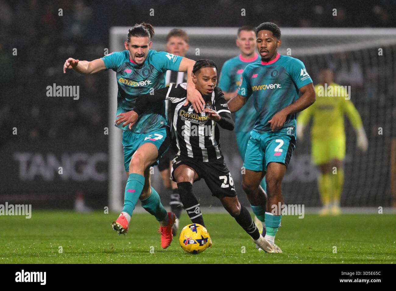 Tyrese Hall of Notts County battles with Ben Fox of Harrogate Town ...
