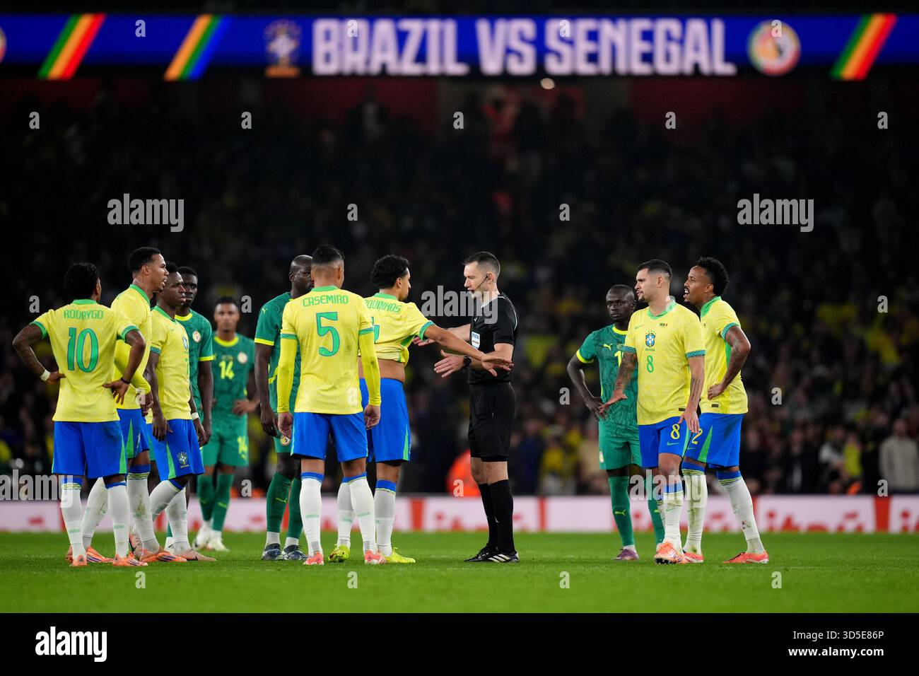 Brazil players surround the referee during a VAR check during an ...