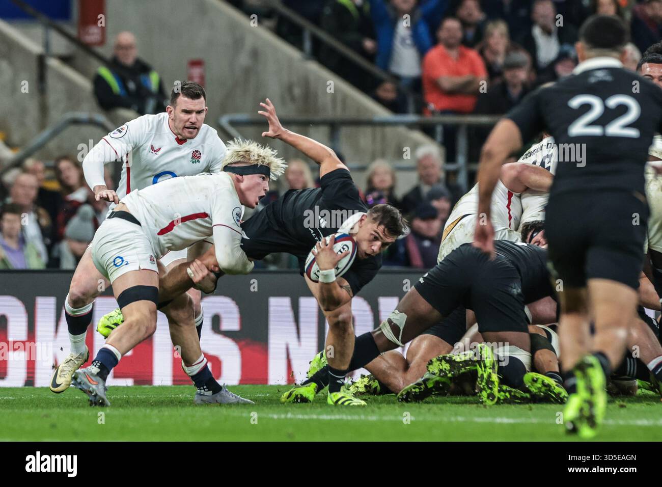 Henry Pollock of England tackles Cortez Ratima of New Zealand during ...