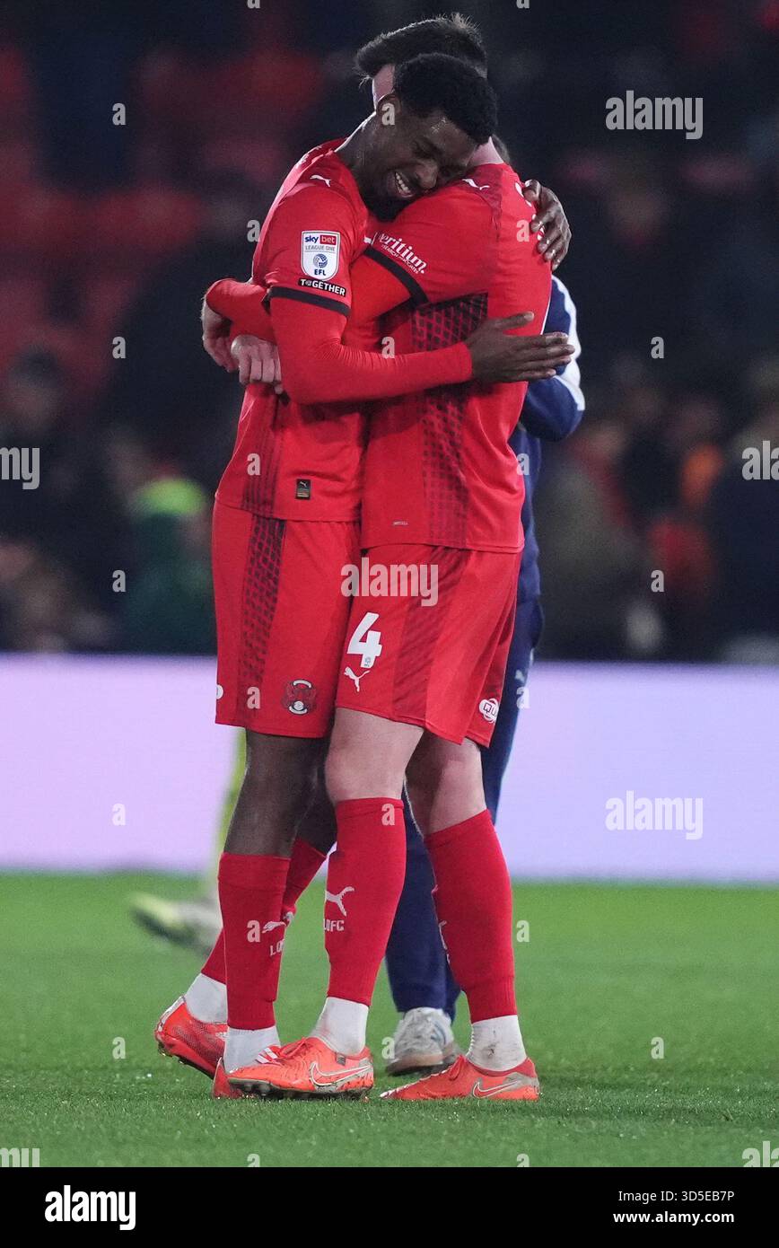 Goal scorer Leyton Orient's Tyreeq Bakinson (left) is hugged by Jack ...