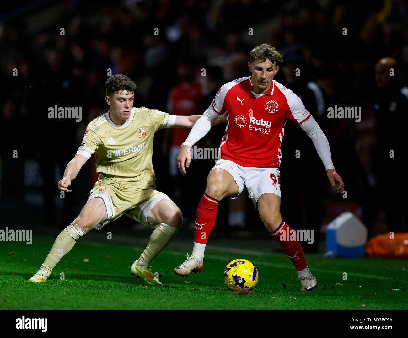 Swindon Town's Gavin Kilkenny (left) and Fleetwood Town's William ...