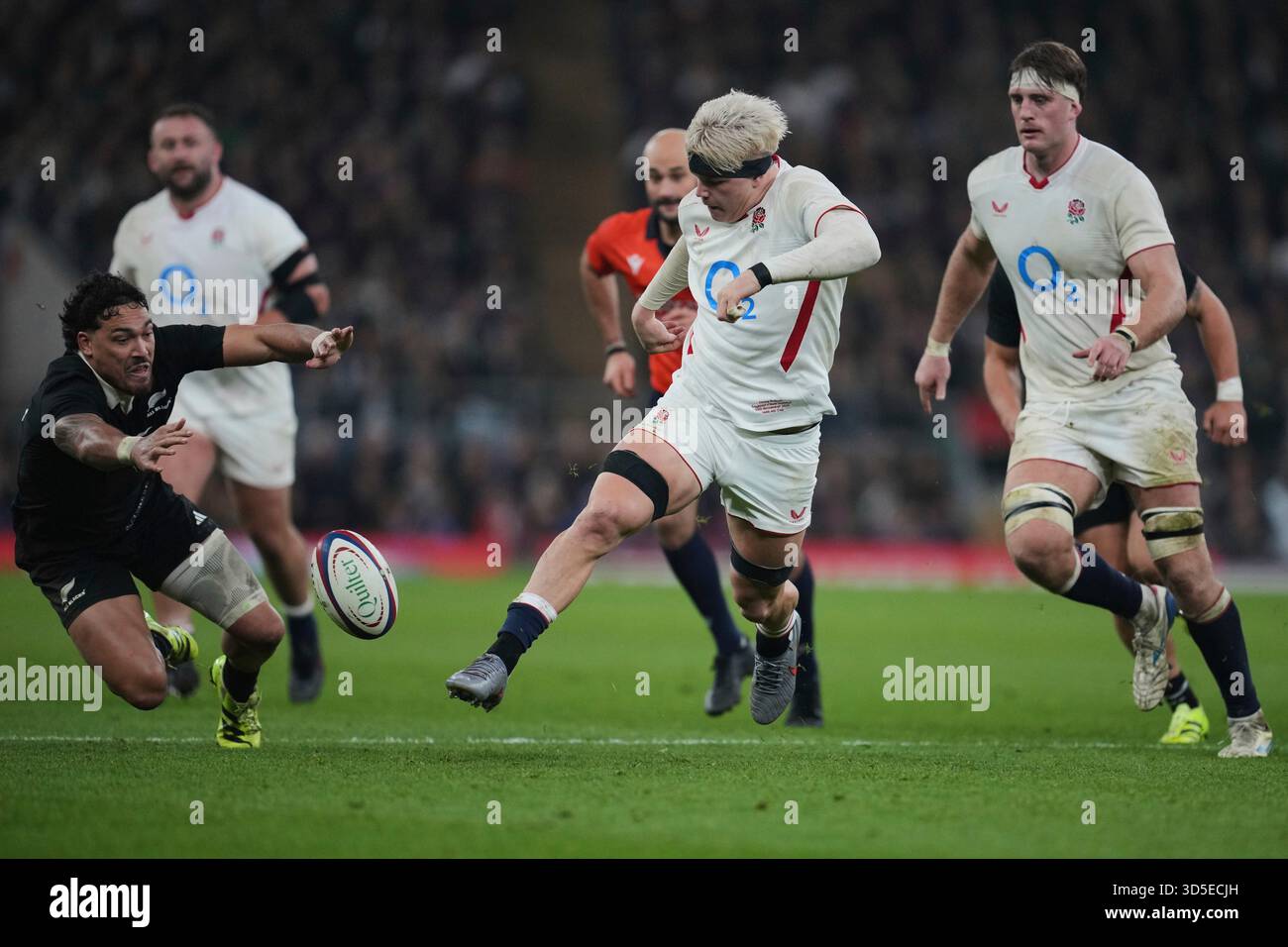England Henry Pollock, center, kicks the ball towards try line during ...